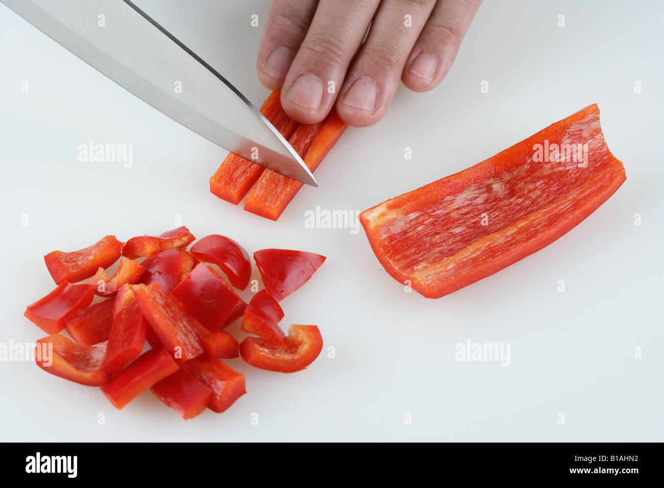 Chopping red pepper Stock Photo - Alamy