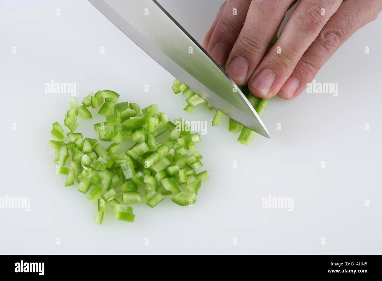Chopping green pepper Stock Photo - Alamy