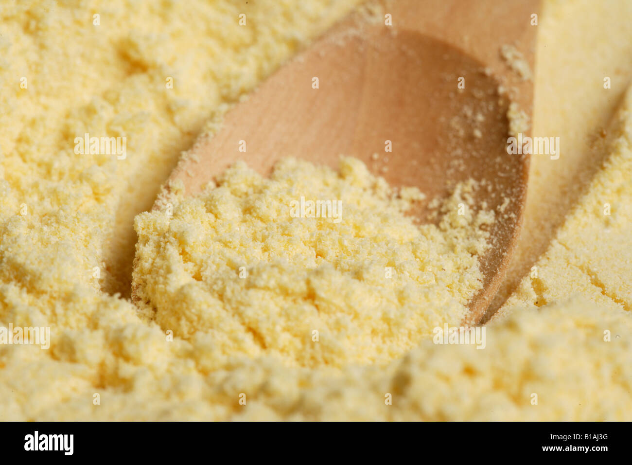 Wooden spoon in flour close up Stock Photo - Alamy