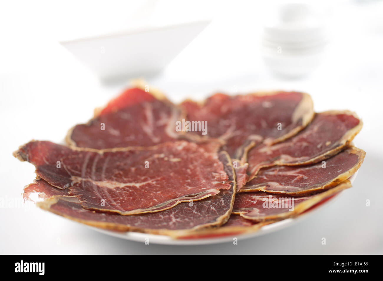 Slices of Cecina from Leon (air dried and smoked cured beef made from ...