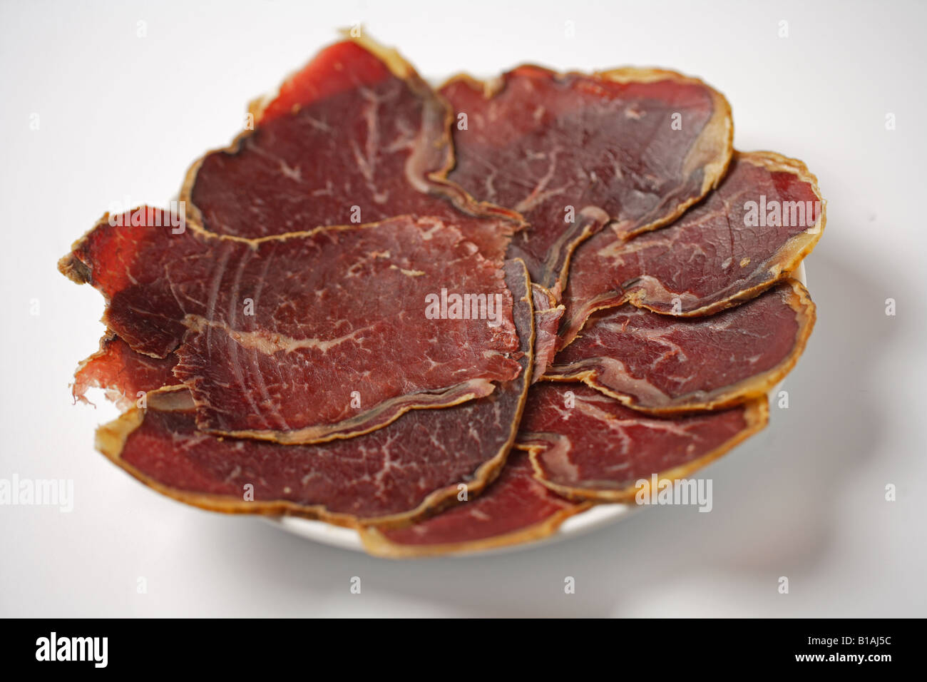 Slices of Cecina from Leon (air dried and smoked cured beef made from ...