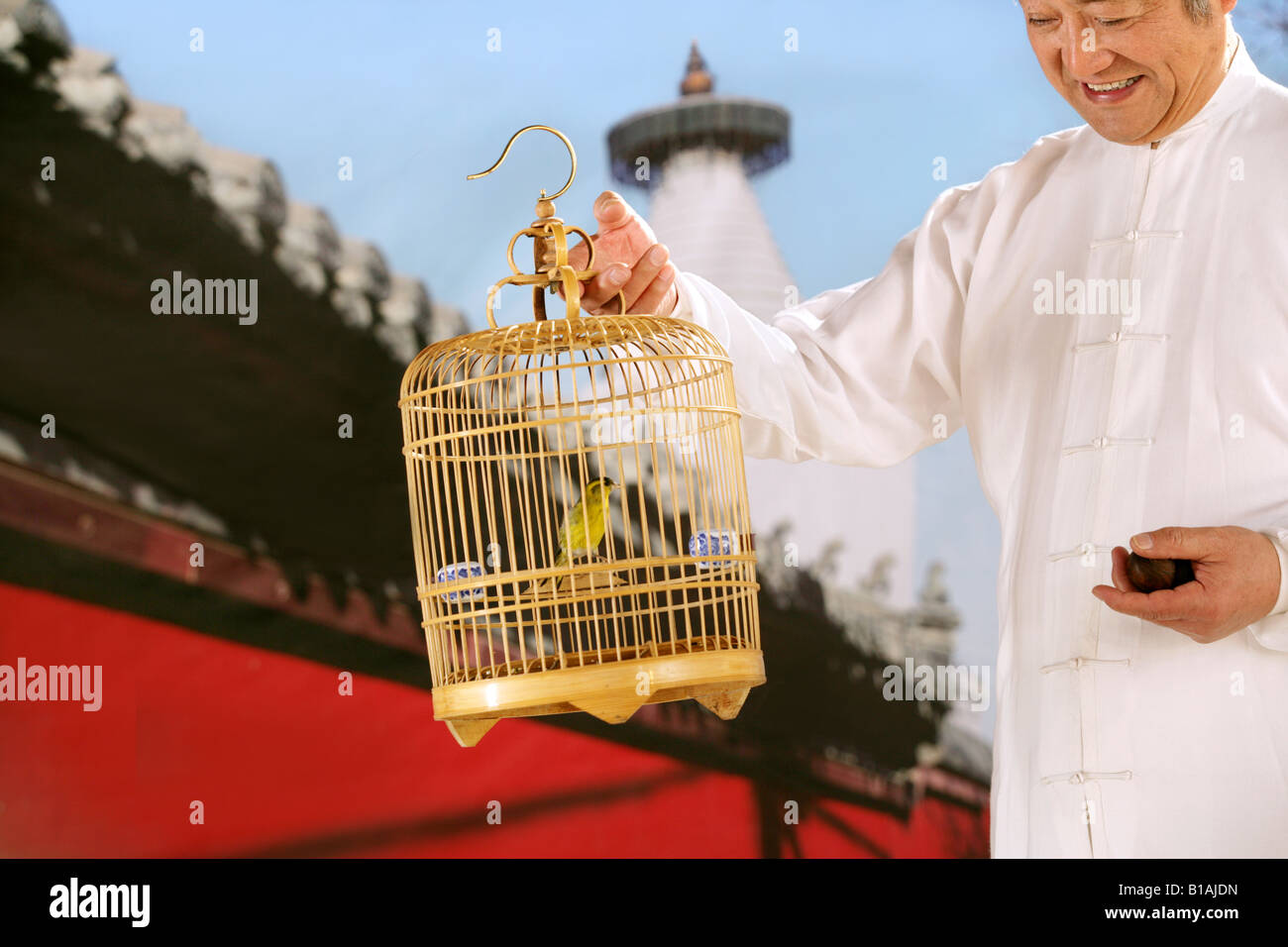 Man holding birdcage hi-res stock photography and images - Alamy