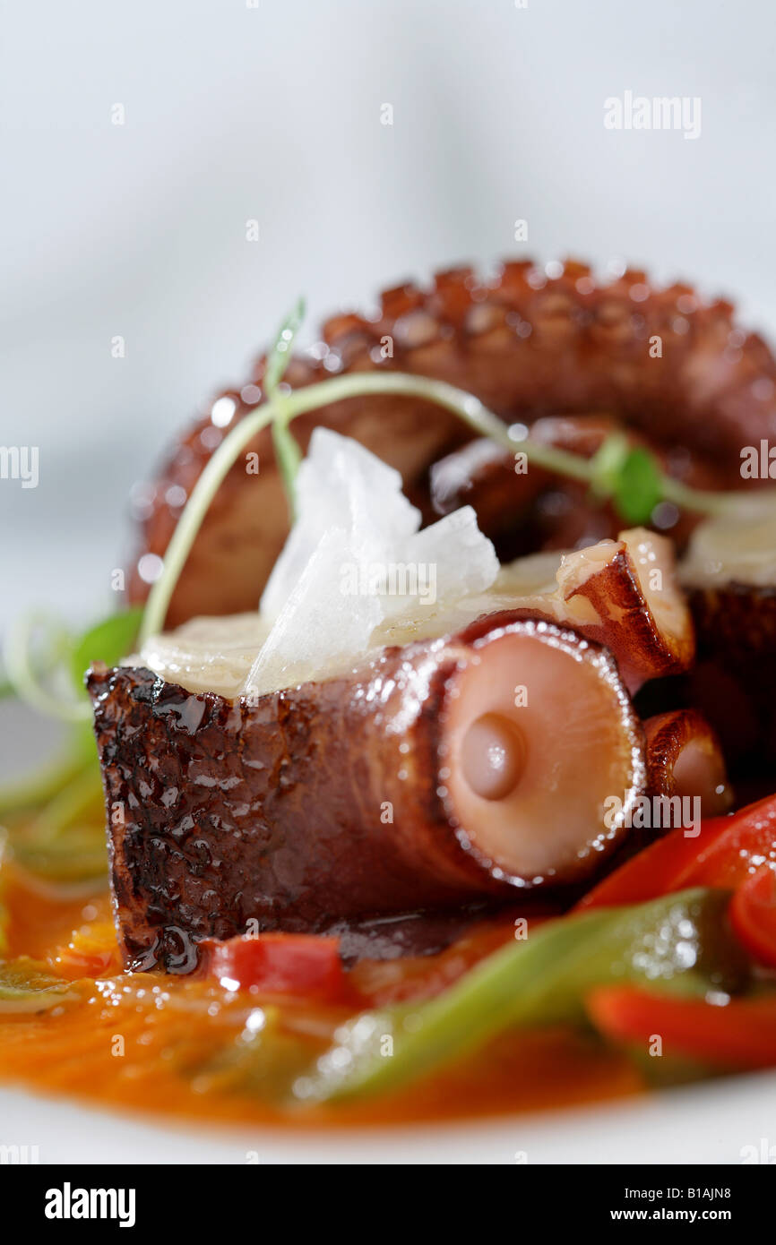 Grilled octopus with vegetables and pepper sauce Stock Photo - Alamy