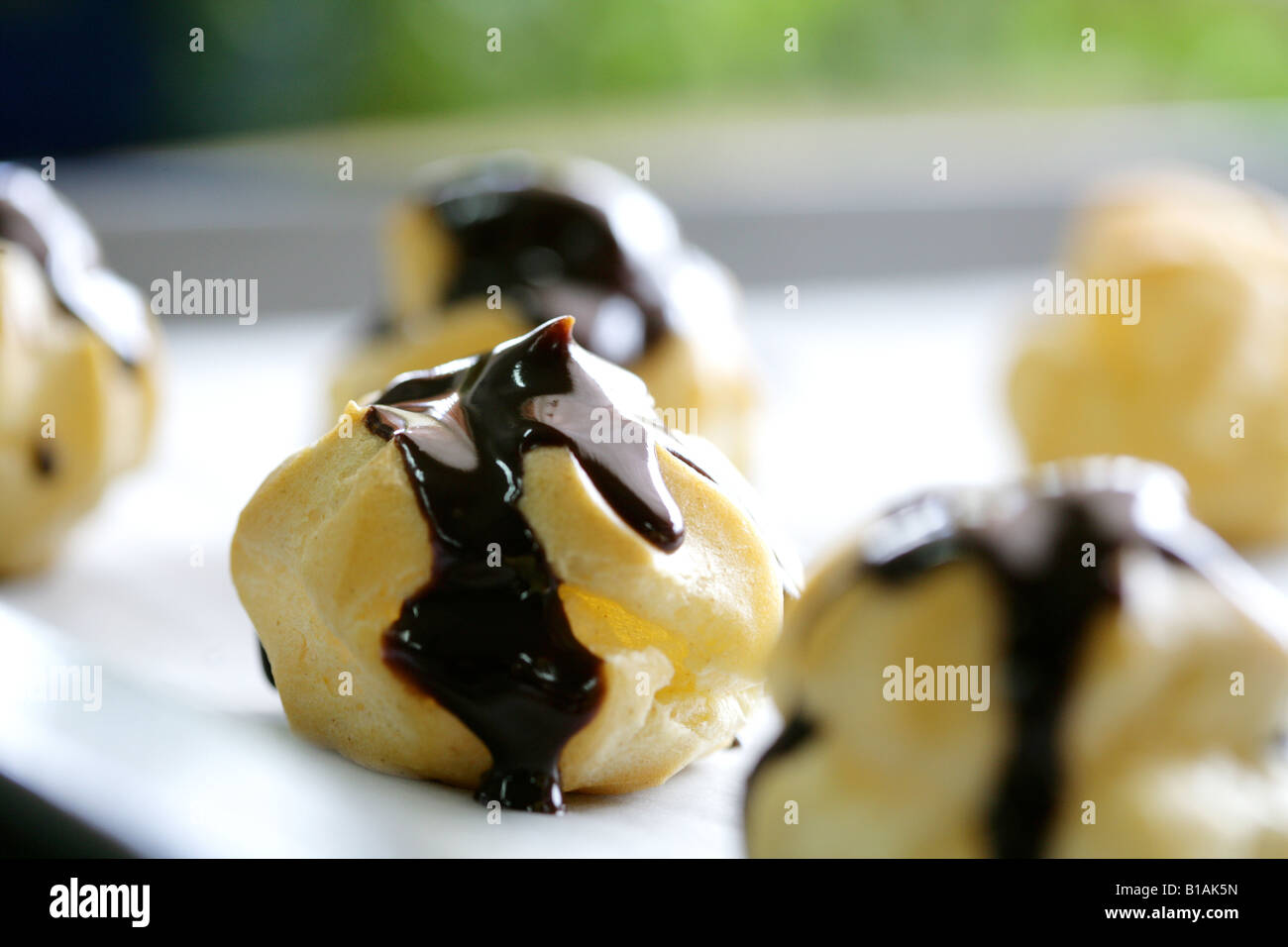 Filled with cream profiteroles Stock Photo - Alamy