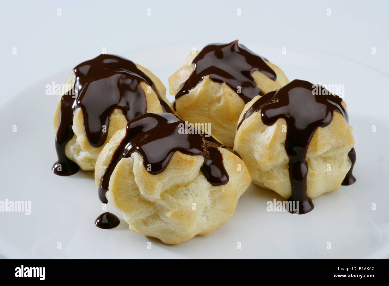 Filled with cream profiteroles Stock Photo - Alamy