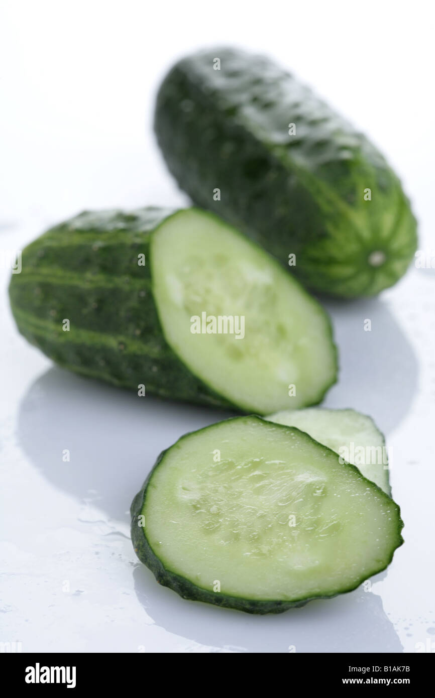 Whole cucumber with slices Stock Photo - Alamy