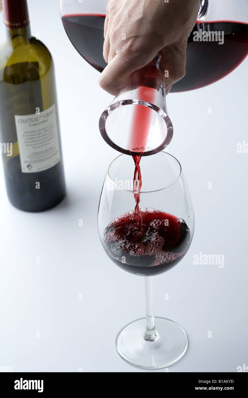 Serving wine with a wine decanter jar Stock Photo - Alamy