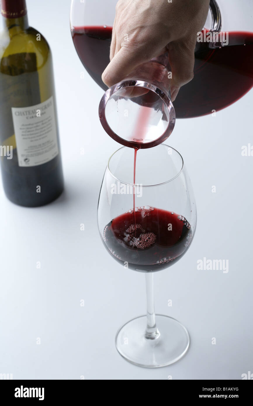 Serving wine with a wine decanter jar Stock Photo - Alamy