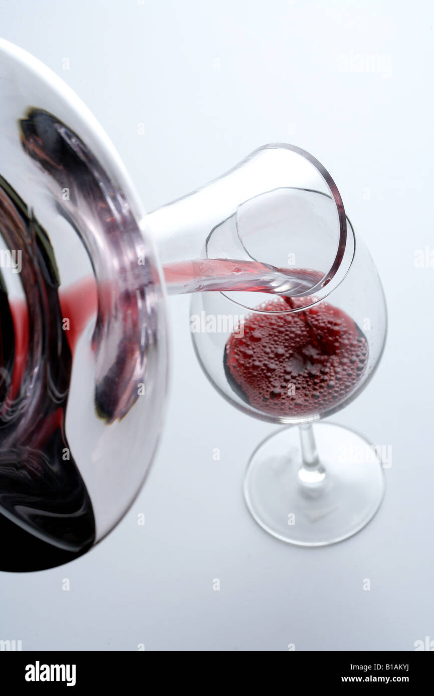 Serving wine with a wine decanter jar Stock Photo - Alamy