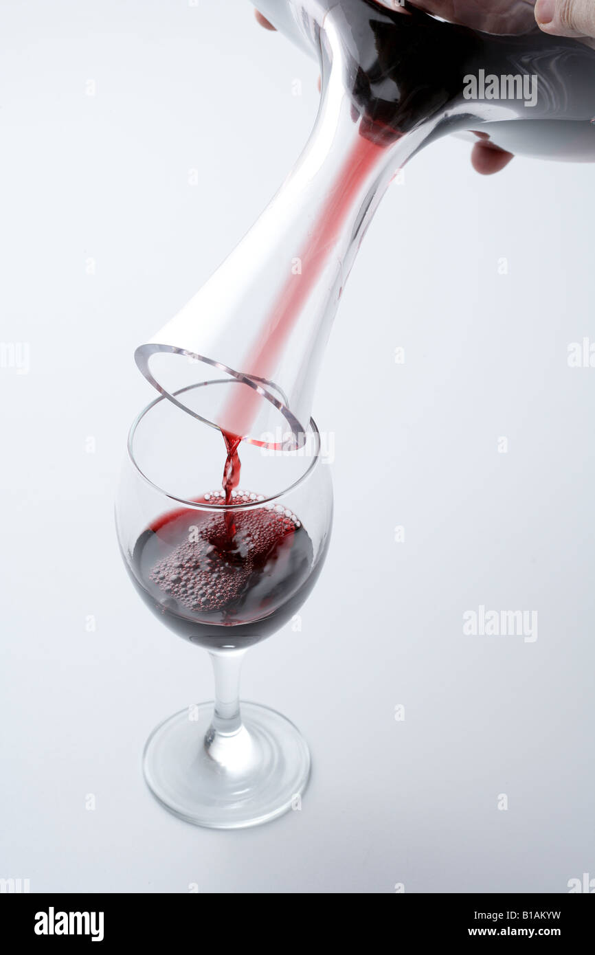 Serving wine with a wine decanter jar Stock Photo - Alamy