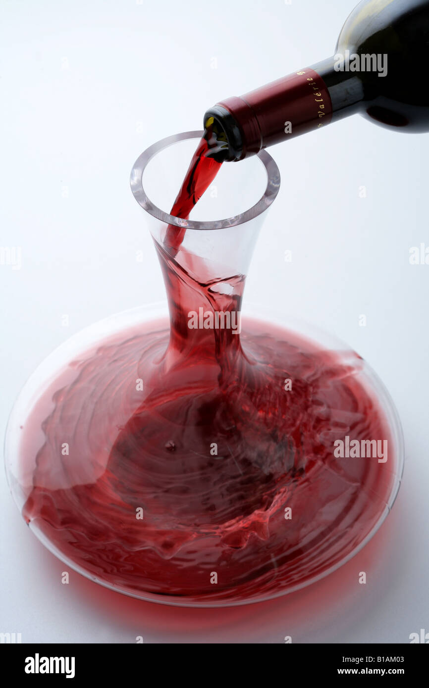Serving wine in a wine decanter jar Stock Photo - Alamy