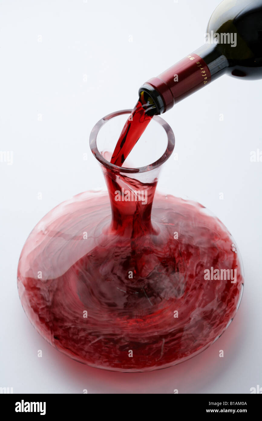 Serving wine in a wine decanter jar Stock Photo - Alamy