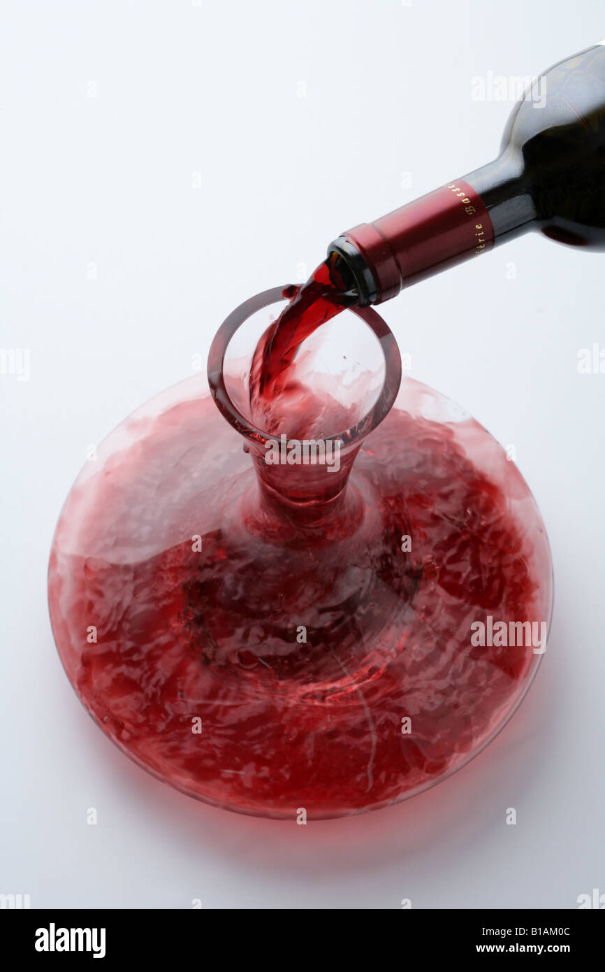 Serving wine in a wine decanter jar Stock Photo - Alamy