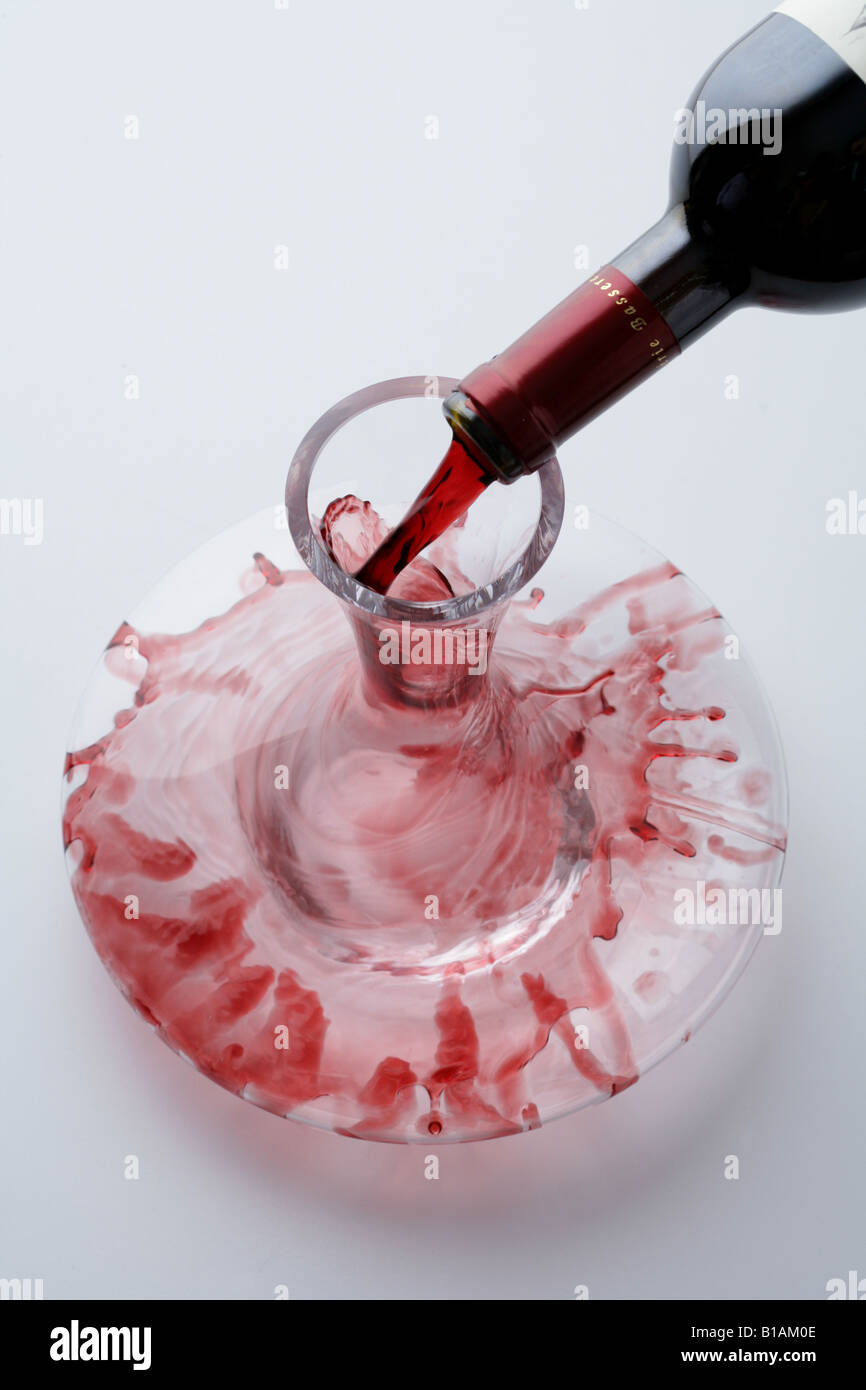 Serving wine in a wine decanter jar Stock Photo - Alamy