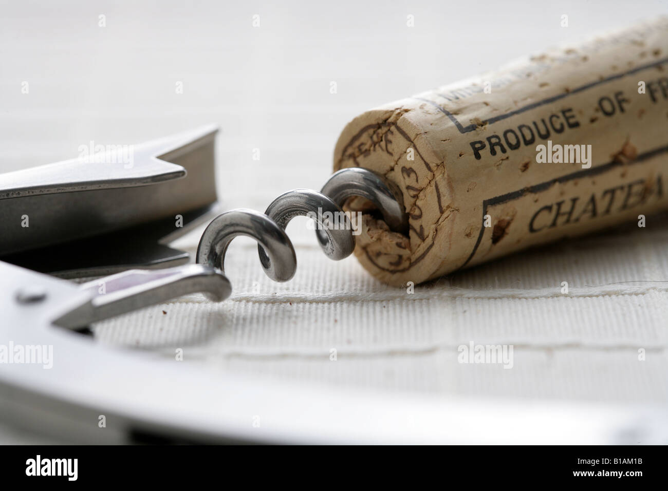 Corkscrew inserted in a cork Stock Photo - Alamy