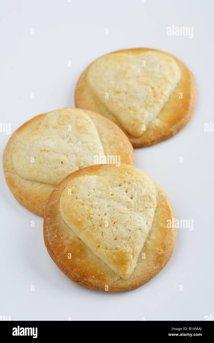 Round and heart-shaped butter cookies on white background Stock Photo ...