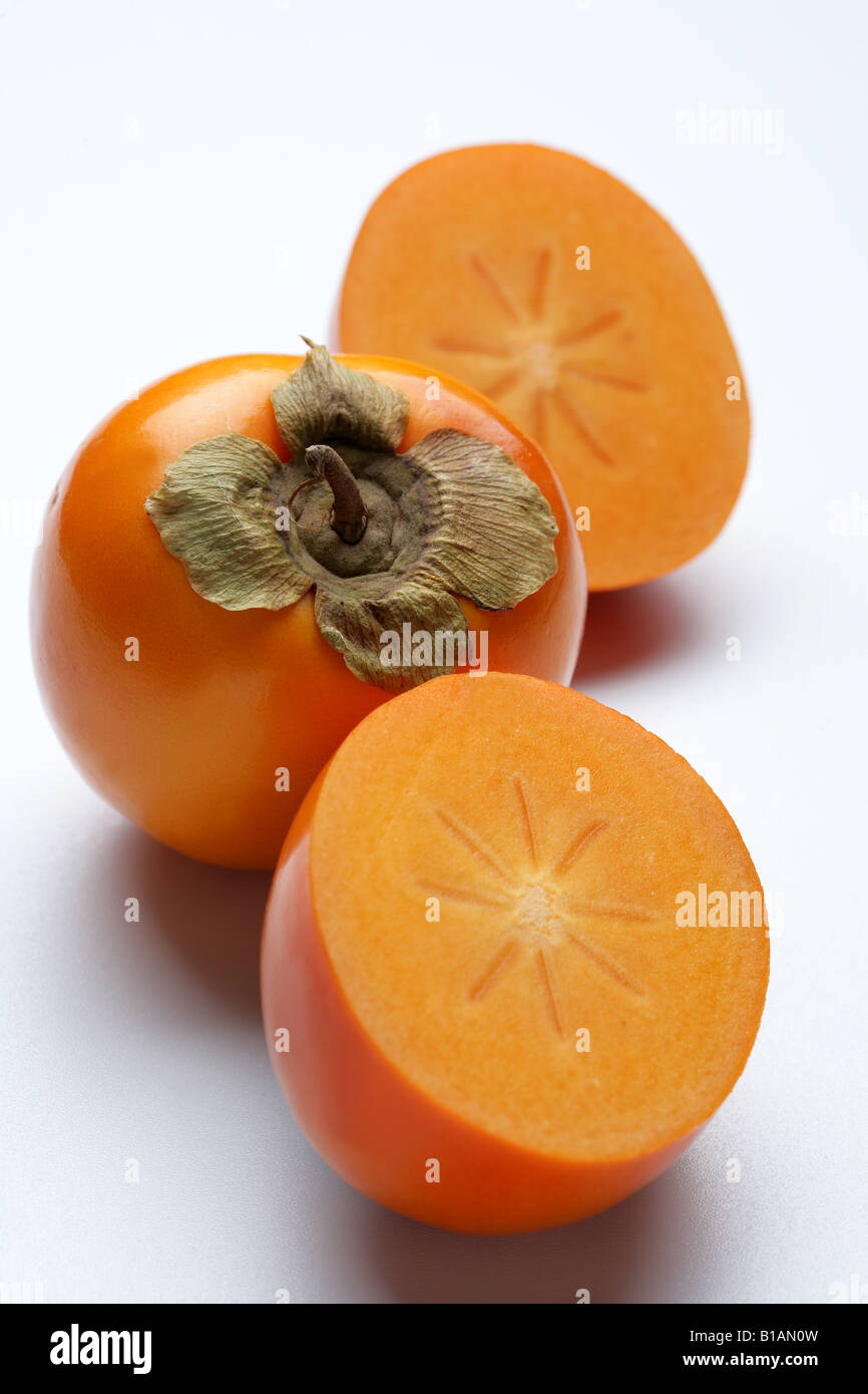 Kaki persimmon or sharon fruits (one opened Stock Photo - Alamy