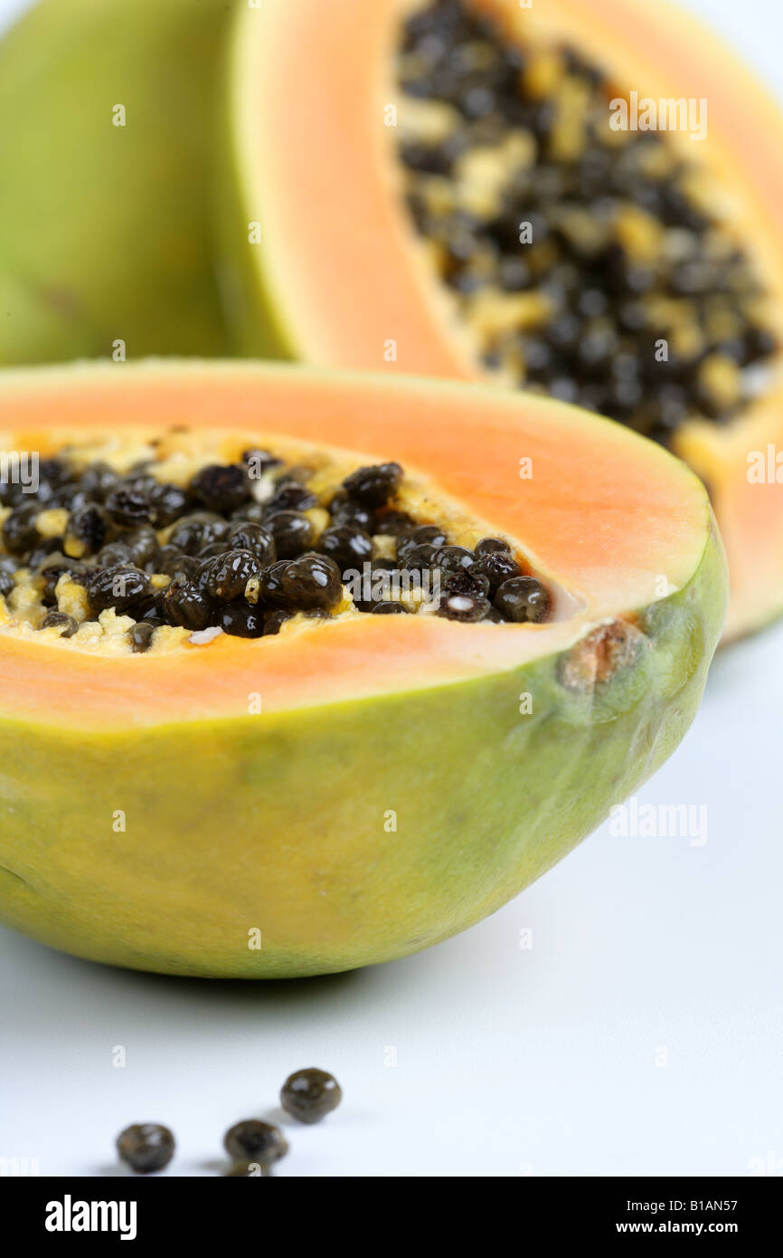 Two papayas (one opened Stock Photo - Alamy