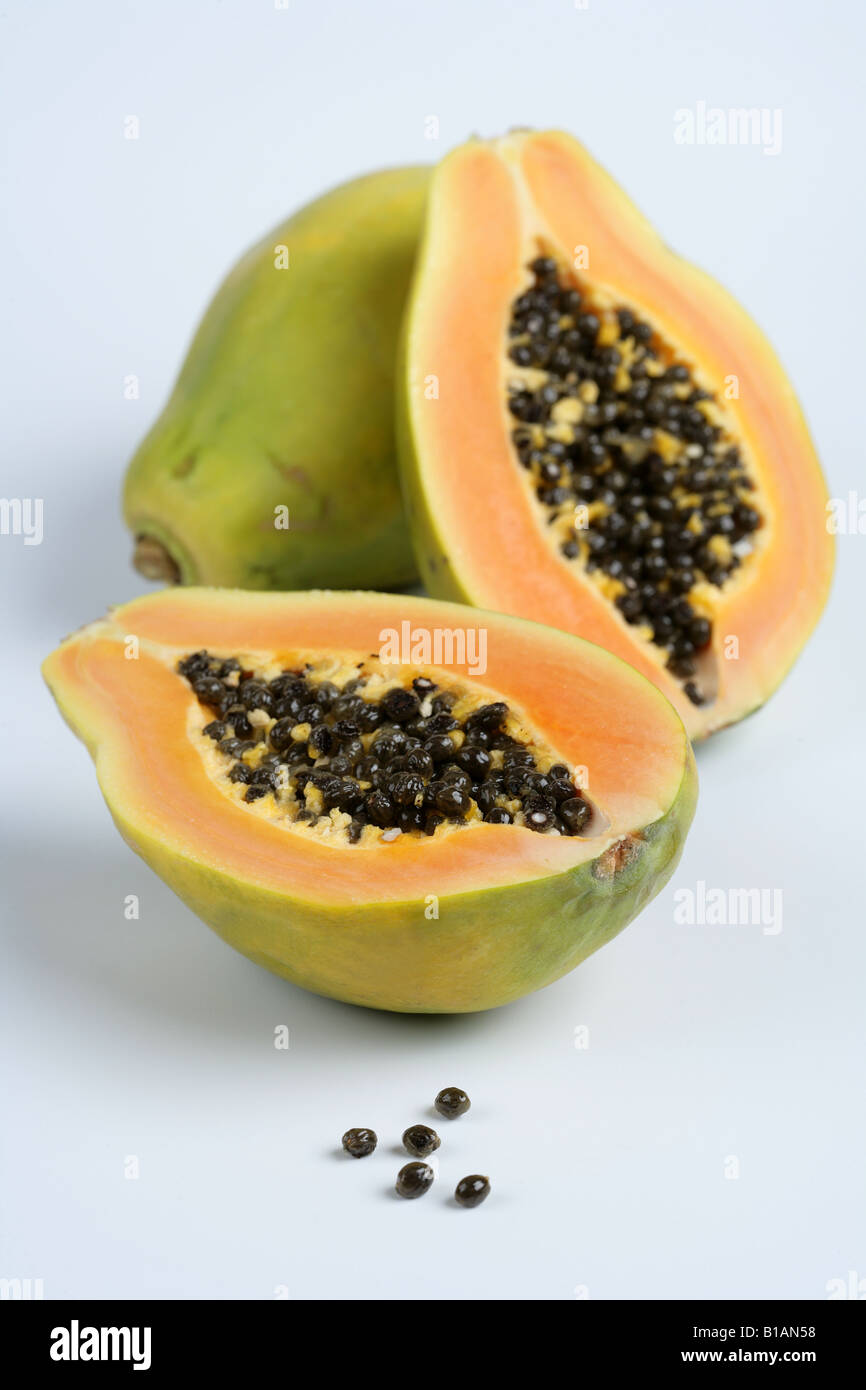 Two papayas (one opened Stock Photo - Alamy