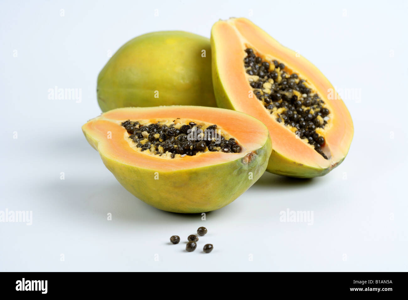 Two papayas (one opened Stock Photo - Alamy