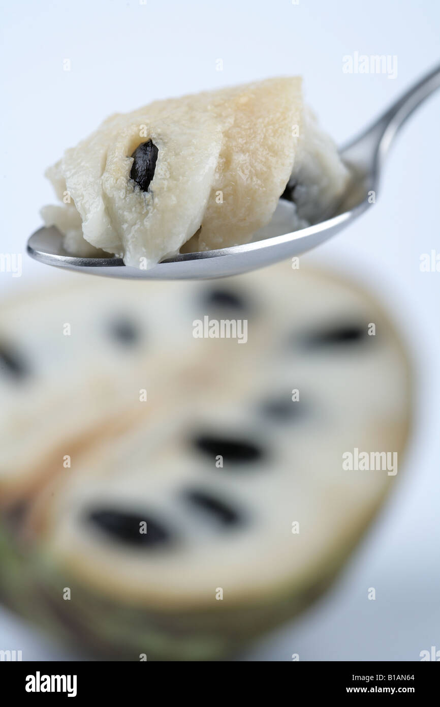 Custard apple pulp on a small spoon Stock Photo - Alamy