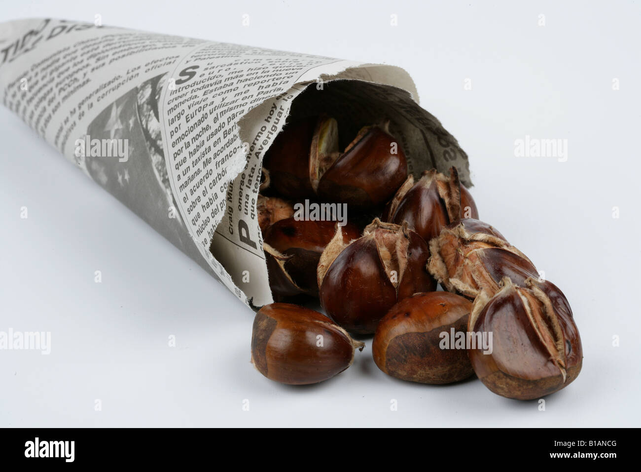 Roasted chestnuts in a newspaper cone Stock Photo - Alamy