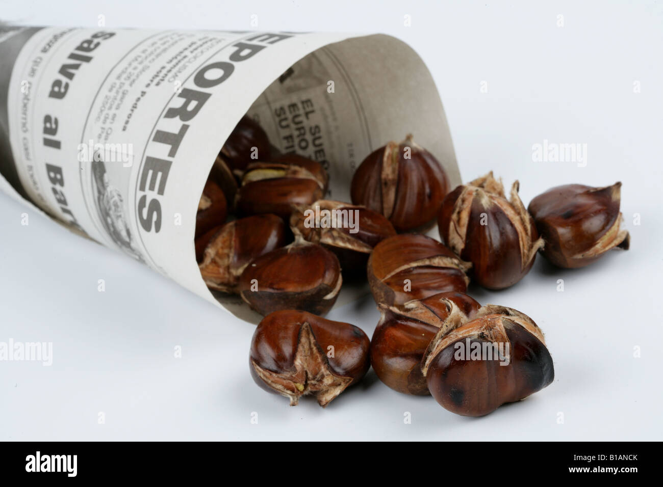 Roasted chestnuts in a newspaper cone Stock Photo - Alamy