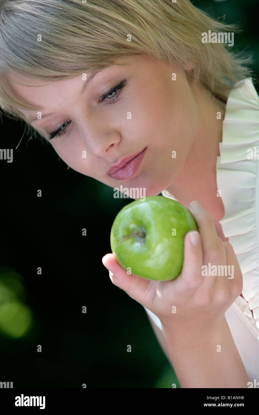 Woman with apple Stock Photo - Alamy