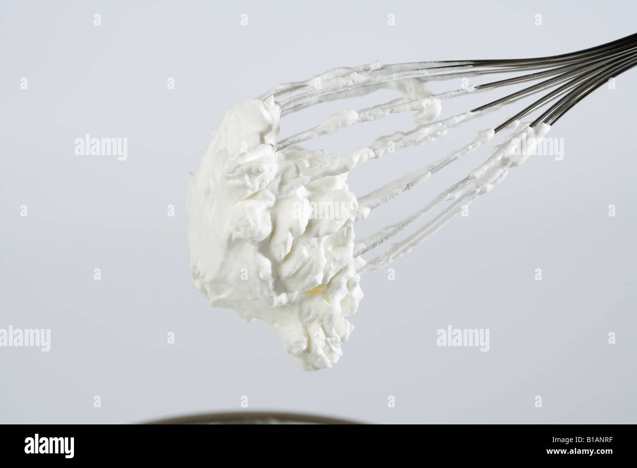 Detail of the whipped cream with the whisk Stock Photo - Alamy