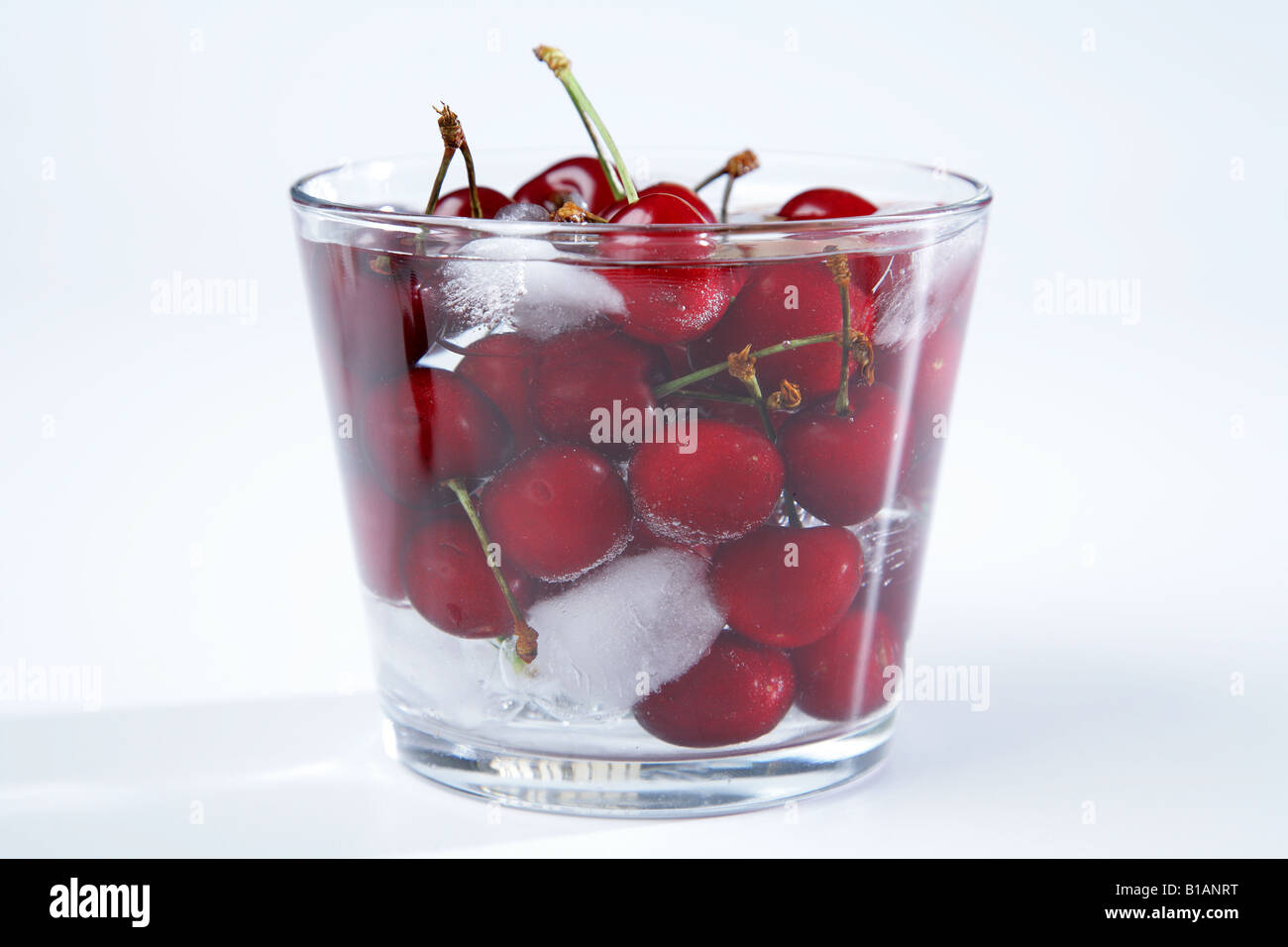 Cherries soaking in water and ice Stock Photo - Alamy