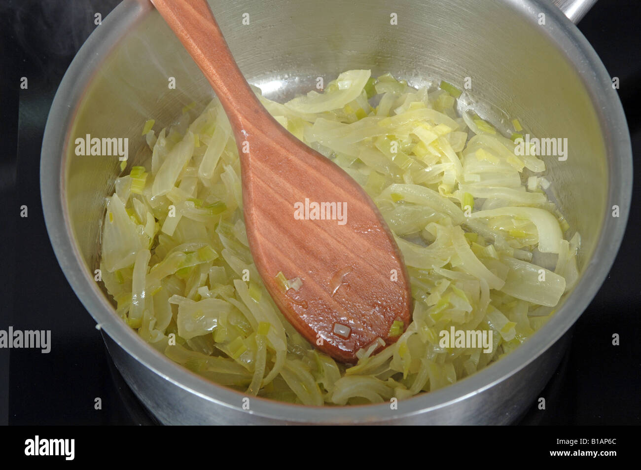 Frying lightly leek Stock Photo - Alamy