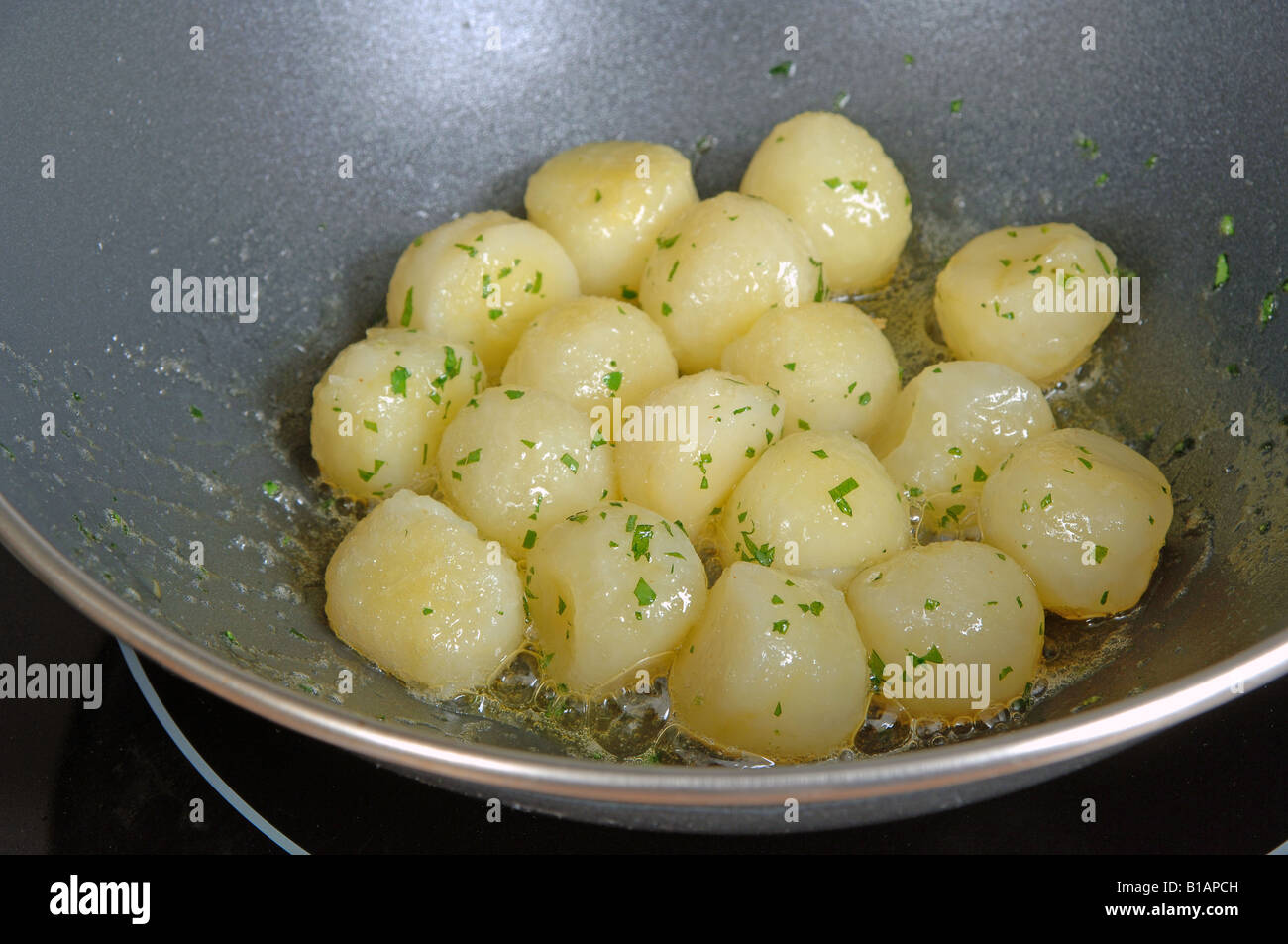 Making sautéed potatoes Stock Photo - Alamy