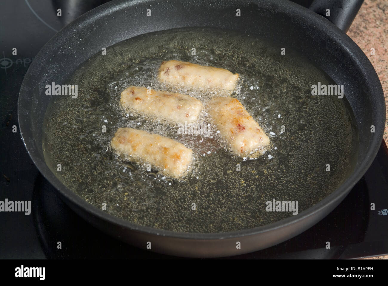Frying frozen food little by little Stock Photo - Alamy