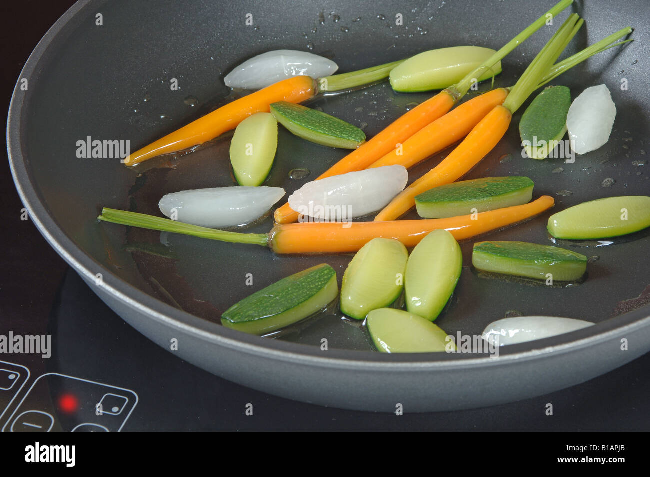 Styr frying shaped vegetables hi-res stock photography and images - Alamy