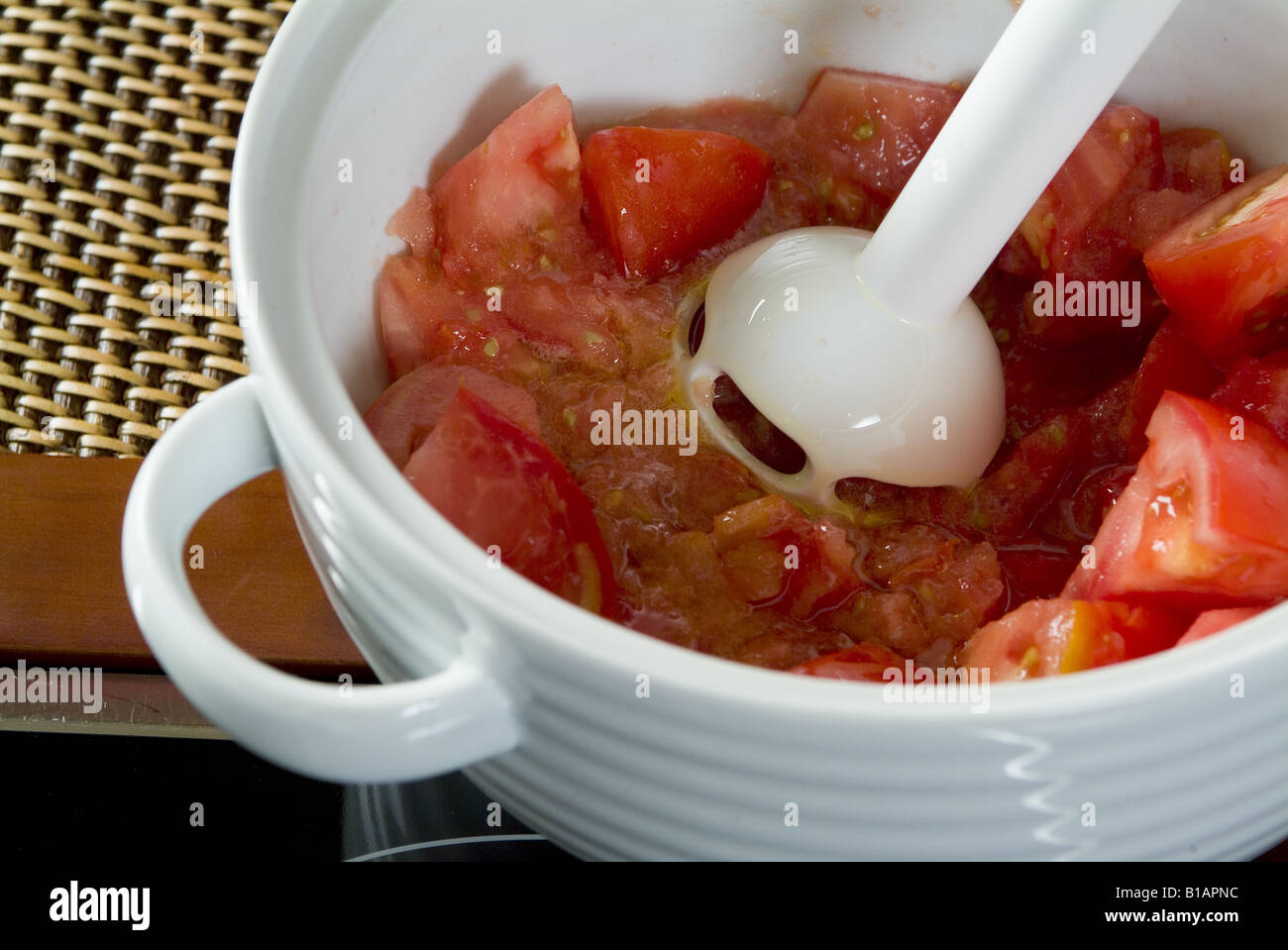 Grinding tomato with oil Stock Photo - Alamy