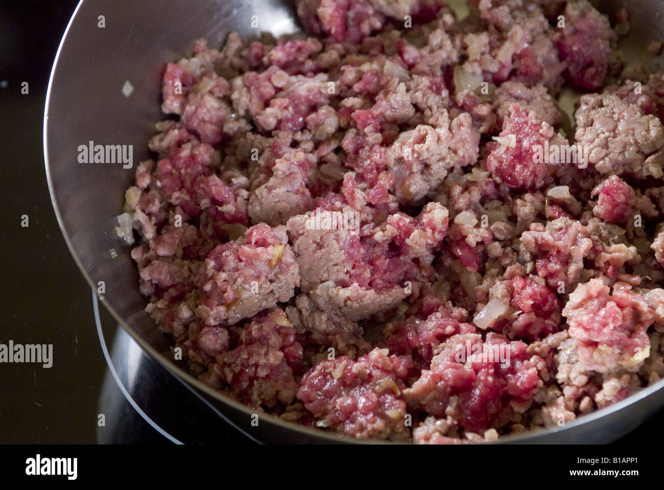 Frying lightly minced beef with onion Stock Photo - Alamy