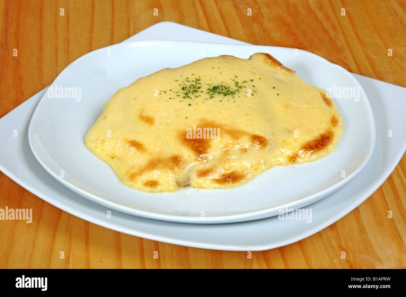 Fish with mayonnaise au gratin Stock Photo - Alamy