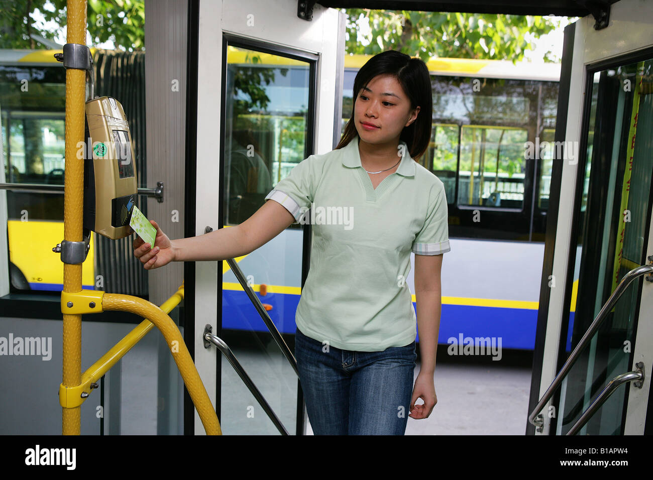 Woman getting on a bus hi-res stock photography and images - Alamy