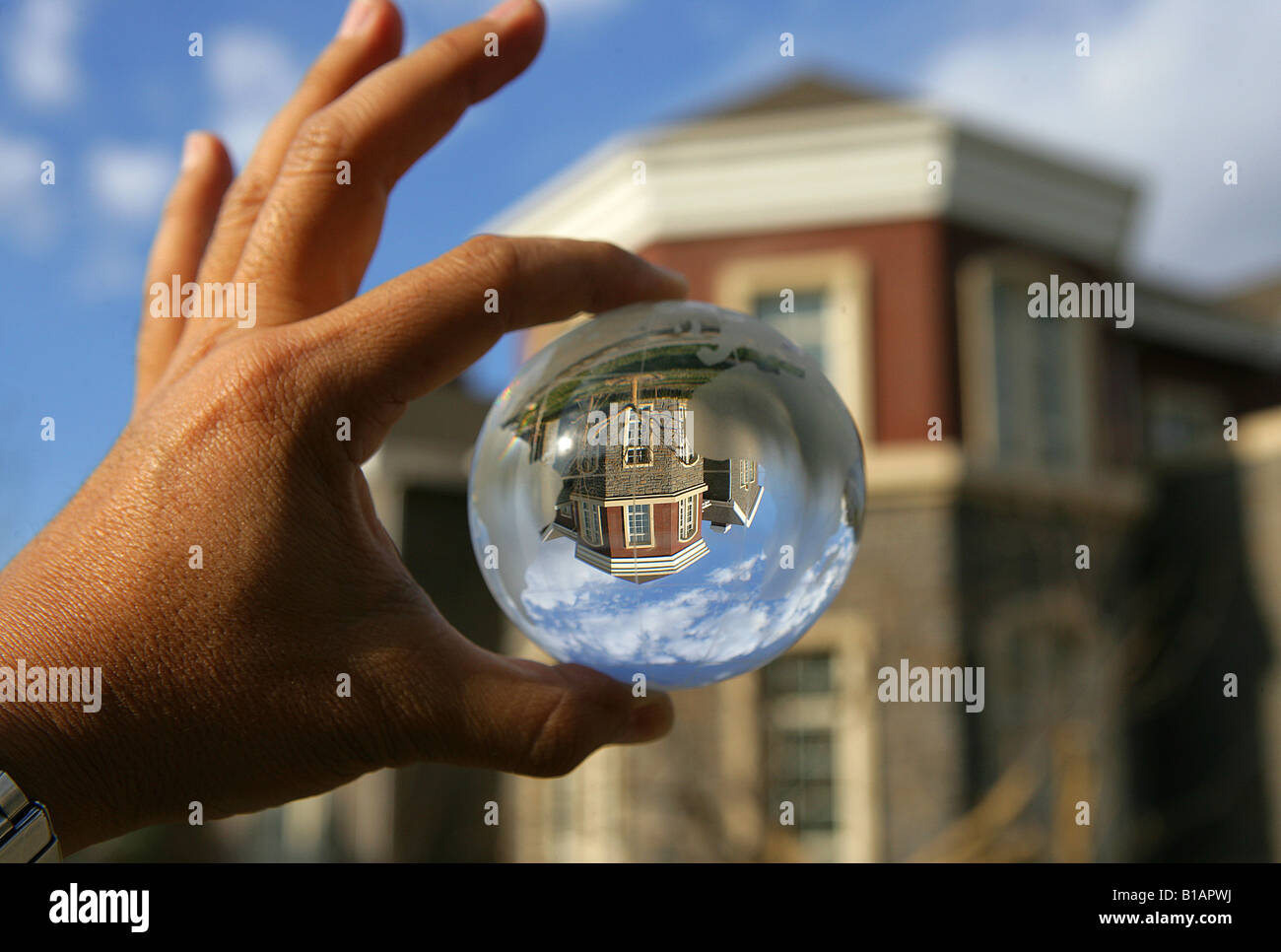 one man holding a crystal ball Stock Photo - Alamy