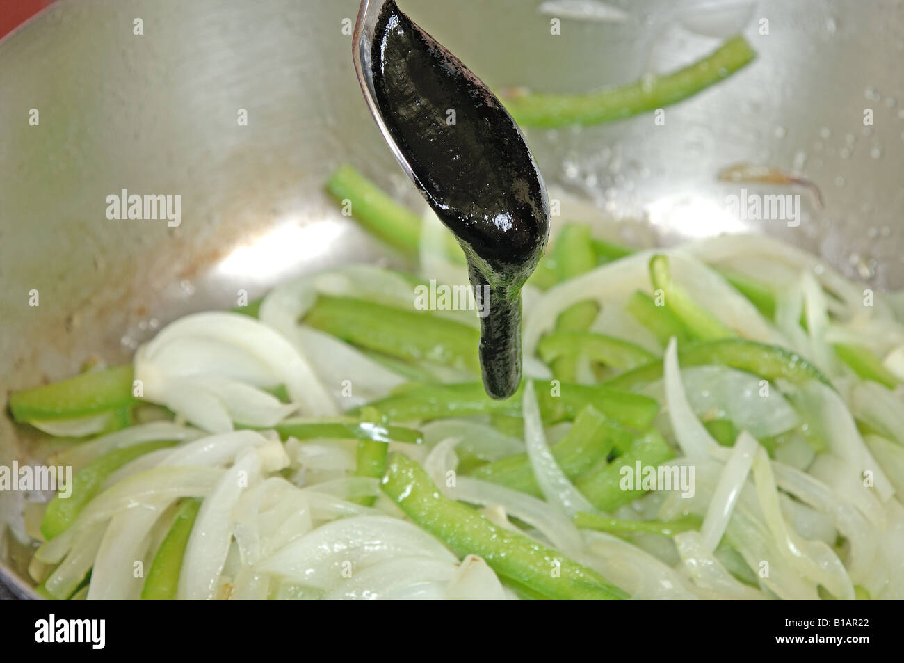 Step 2 Baby squid in ink sauce Stock Photo - Alamy