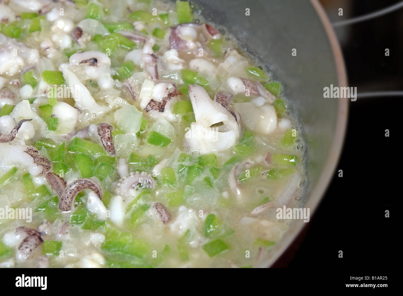 Step 1 Baby squid in ink sauce Stock Photo - Alamy