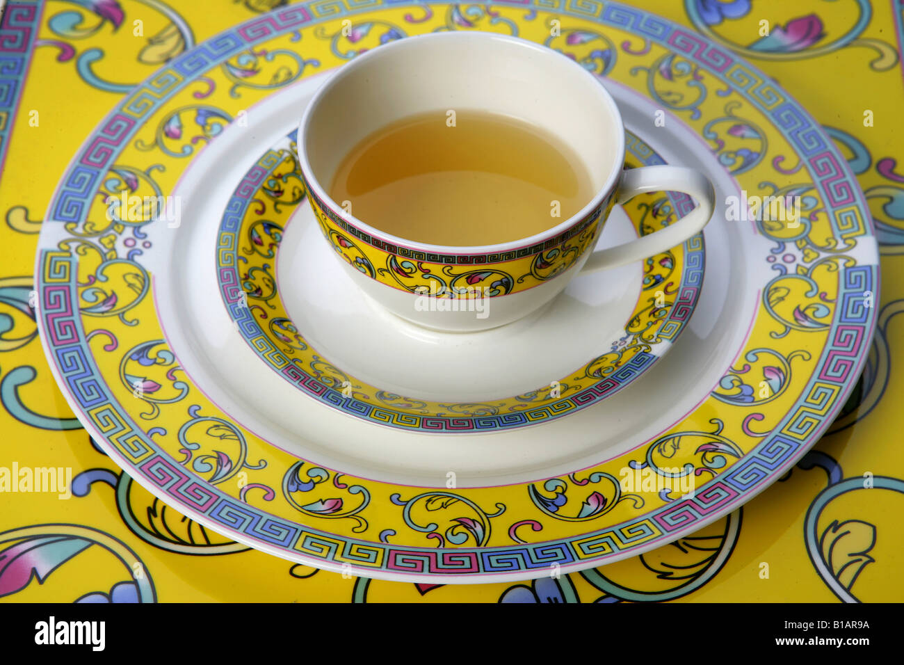 teacup and stack of dishes Stock Photo - Alamy