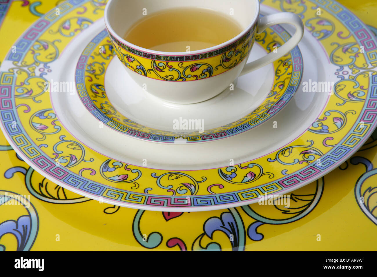 teacup and stack of dishes Stock Photo - Alamy