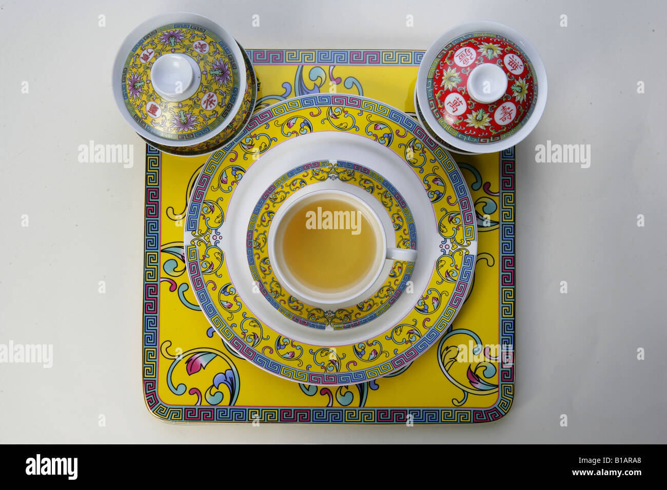 teacup and stack of dishes Stock Photo - Alamy