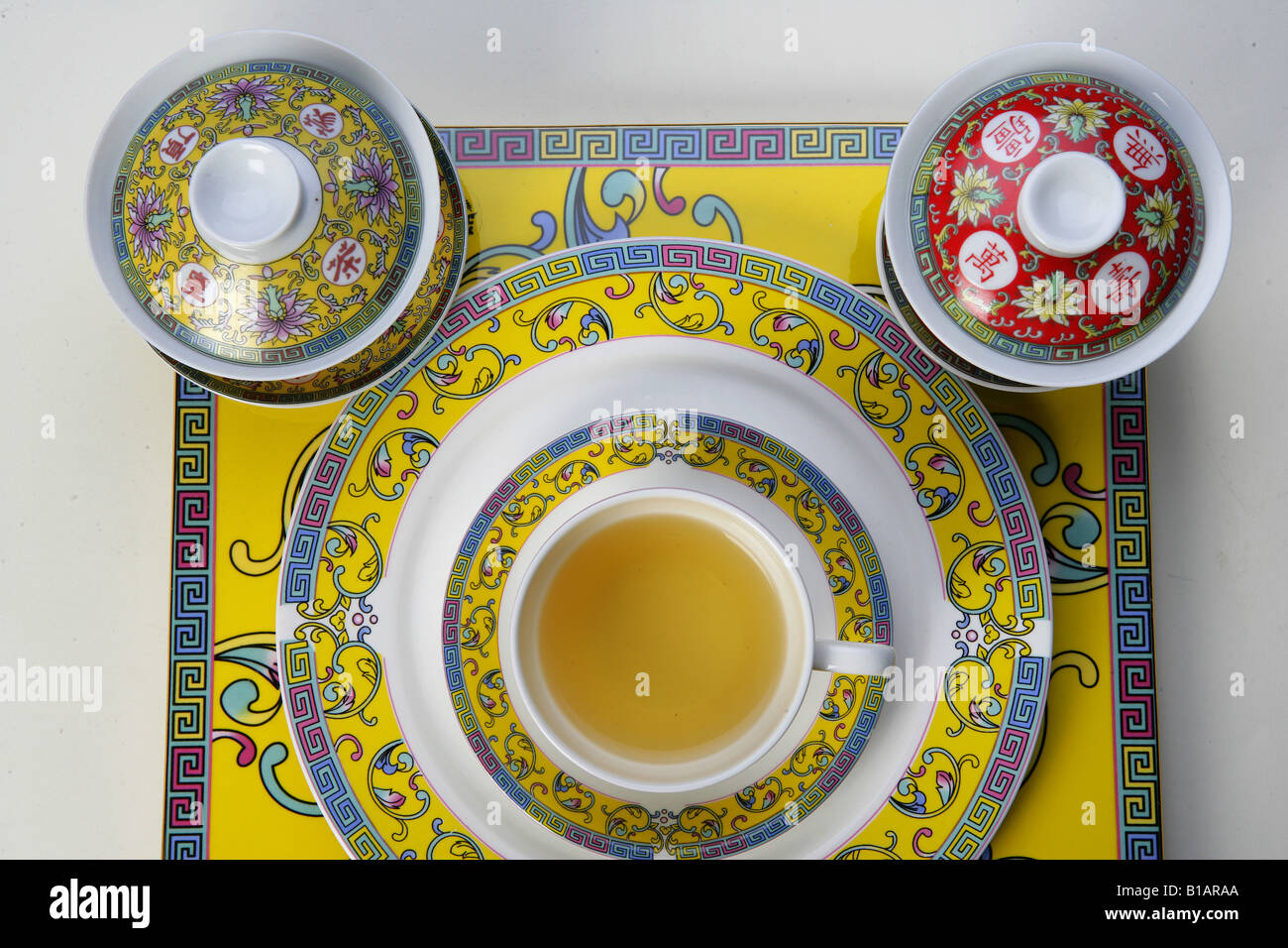 teacup and stack of dishes Stock Photo - Alamy