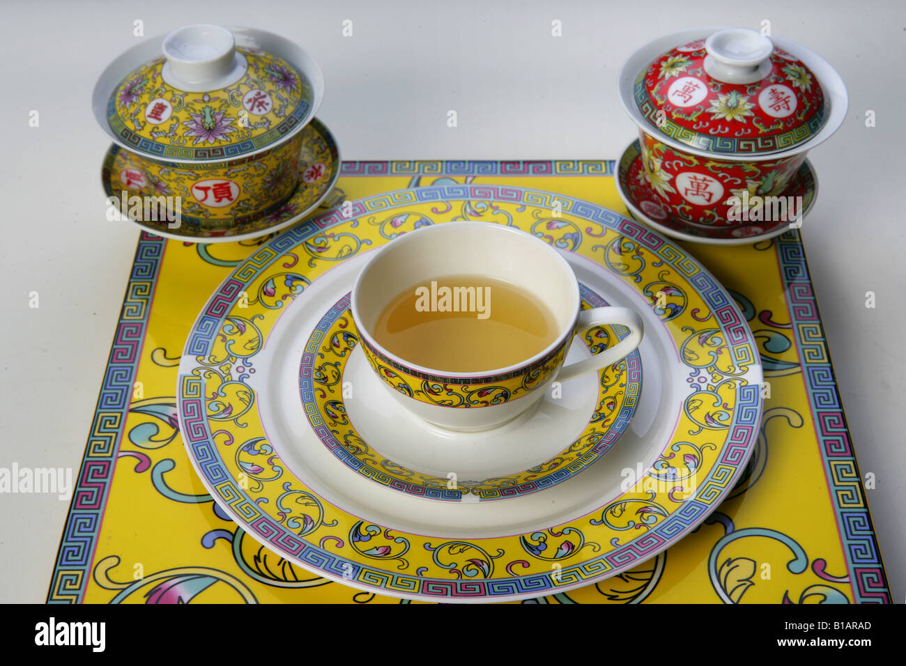 teacup and stack of dishes Stock Photo - Alamy