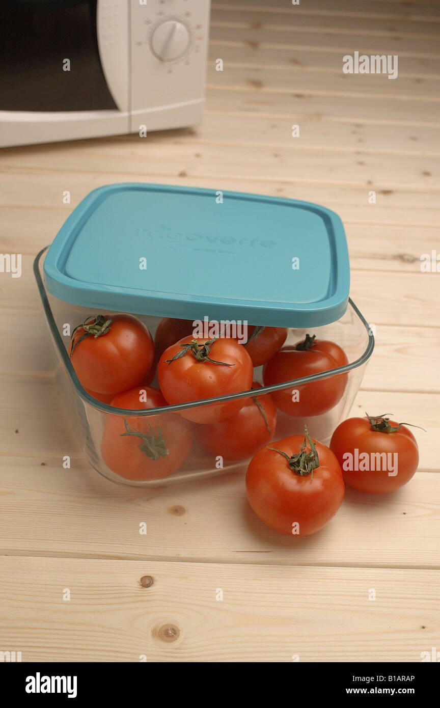 Glass lunch box with tomatoes Stock Photo - Alamy