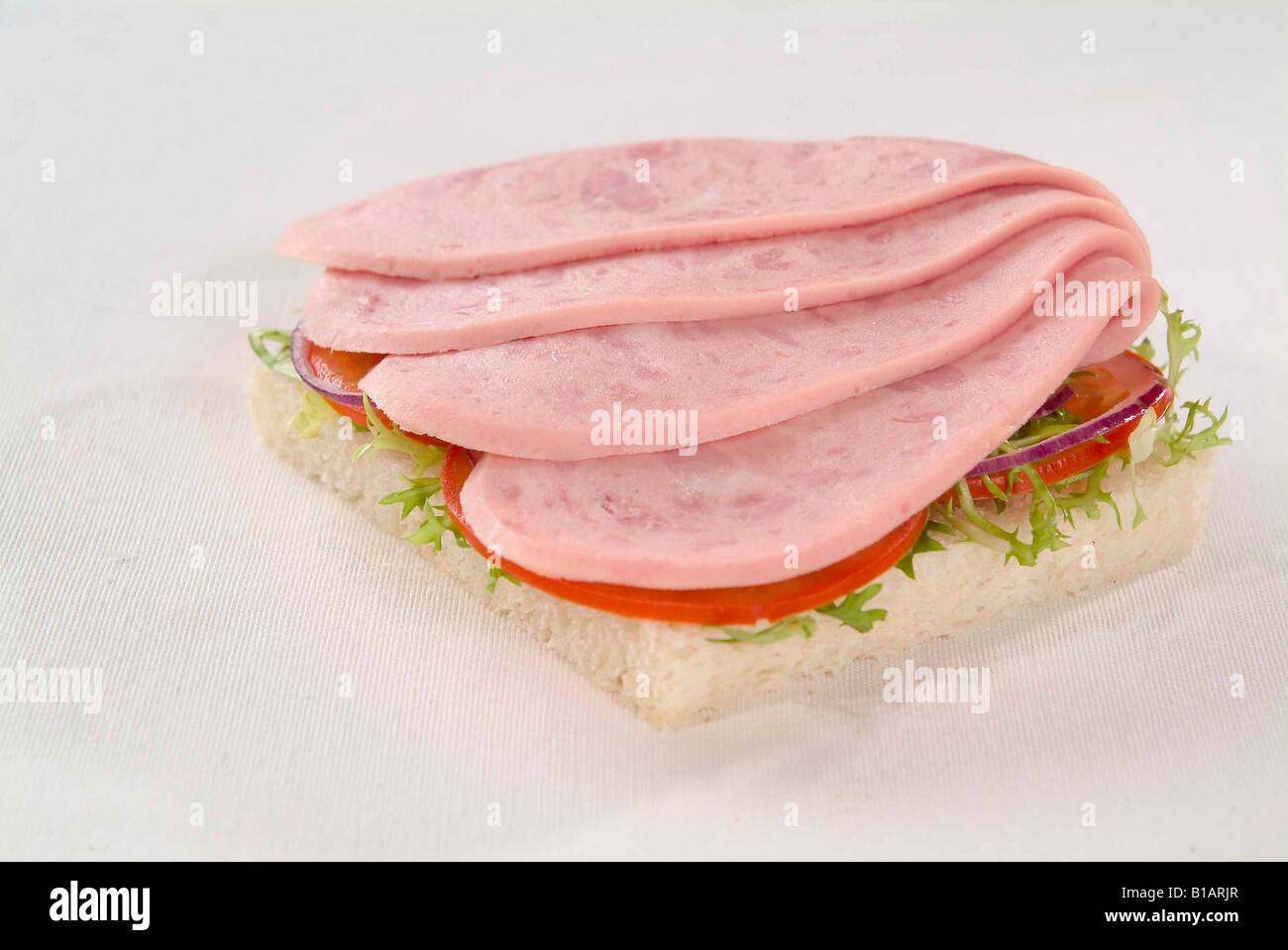 Toast with sliced ham and tomato Stock Photo - Alamy