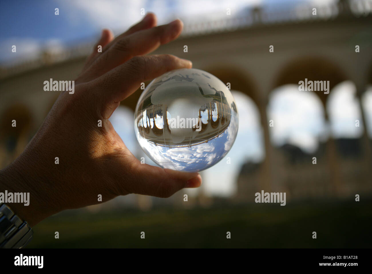 one man holding a crystal ball Stock Photo - Alamy