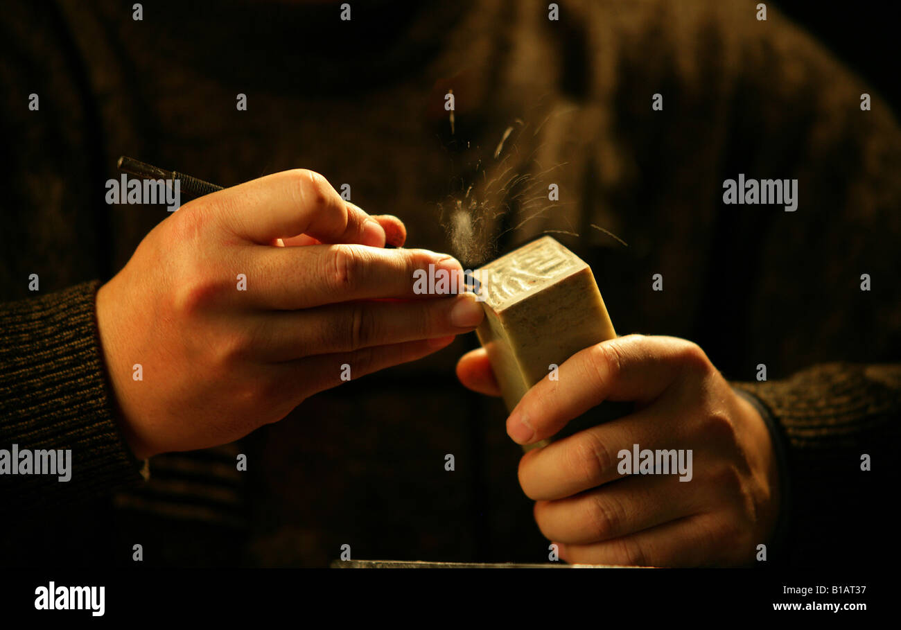 Man hands carving traditional chop hi-res stock photography and images ...